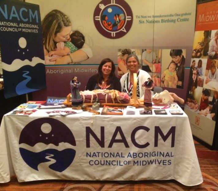 Indigenous midwives Ellen Blais and Laurie Jacobs at NACM booth at ...